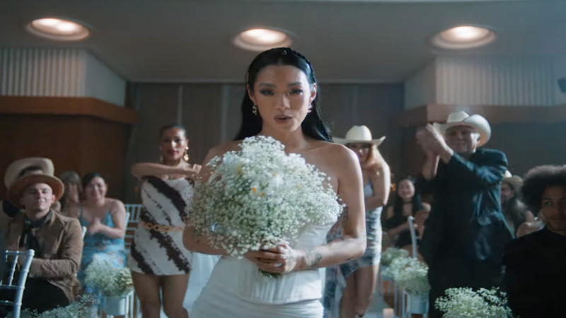 Rina Sawayama fearlessly line dances down the aisle in new music video ...